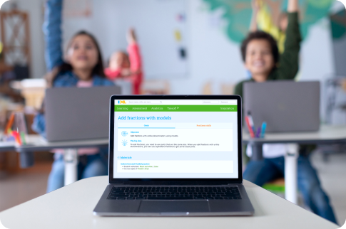 Computer in front of a classroom of students